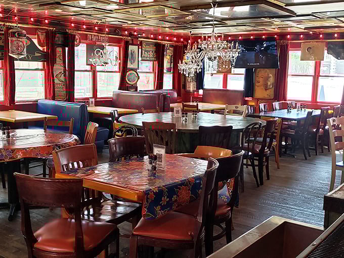 Red walls, mismatched tables, and vintage tablecloths create a dining room that feels like your eccentric aunt's place—if she had impeccable taste and a killer chef.