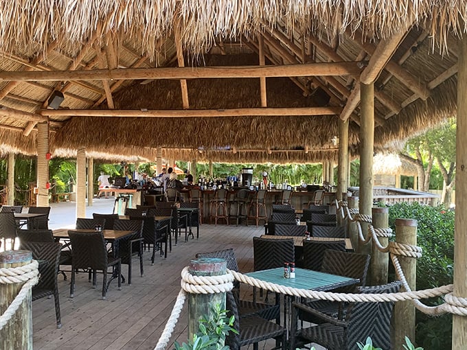 Thatched roof, tropical breeze, and tables waiting for memories to be made—dining doesn't get more quintessentially Keys than this.