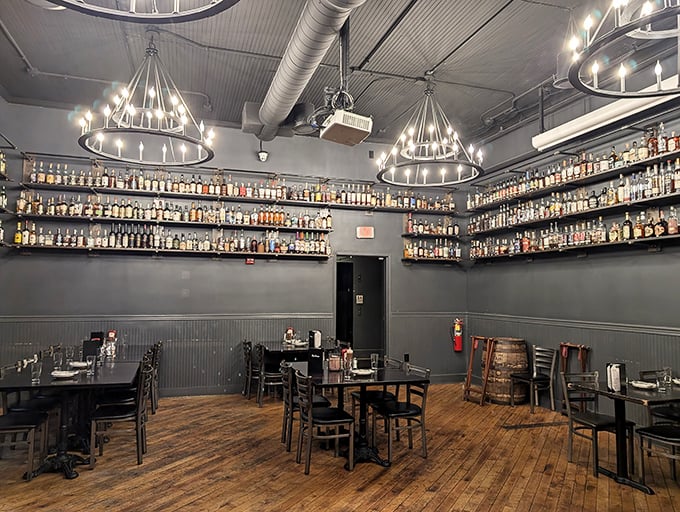 Walls lined with enough bourbon to make prohibition weep. This dining room isn't just serving meals—it's offering a spiritual experience.