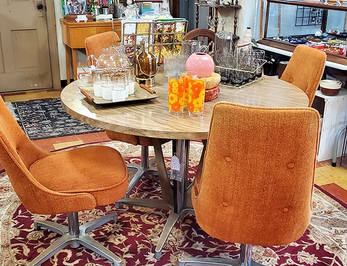 Mid-century modern perfection in burnt orange. This dining set isn't just furniture—it's a portal to cocktail parties and family dinners from the Space Age. 