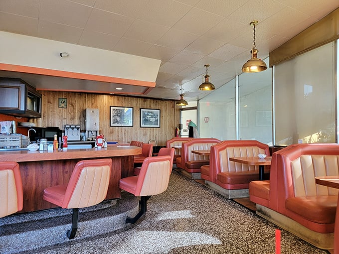 The dining area feels like a living museum of American restaurant design—where the lighting is always flattering and the conversation flows as easily as the coffee.