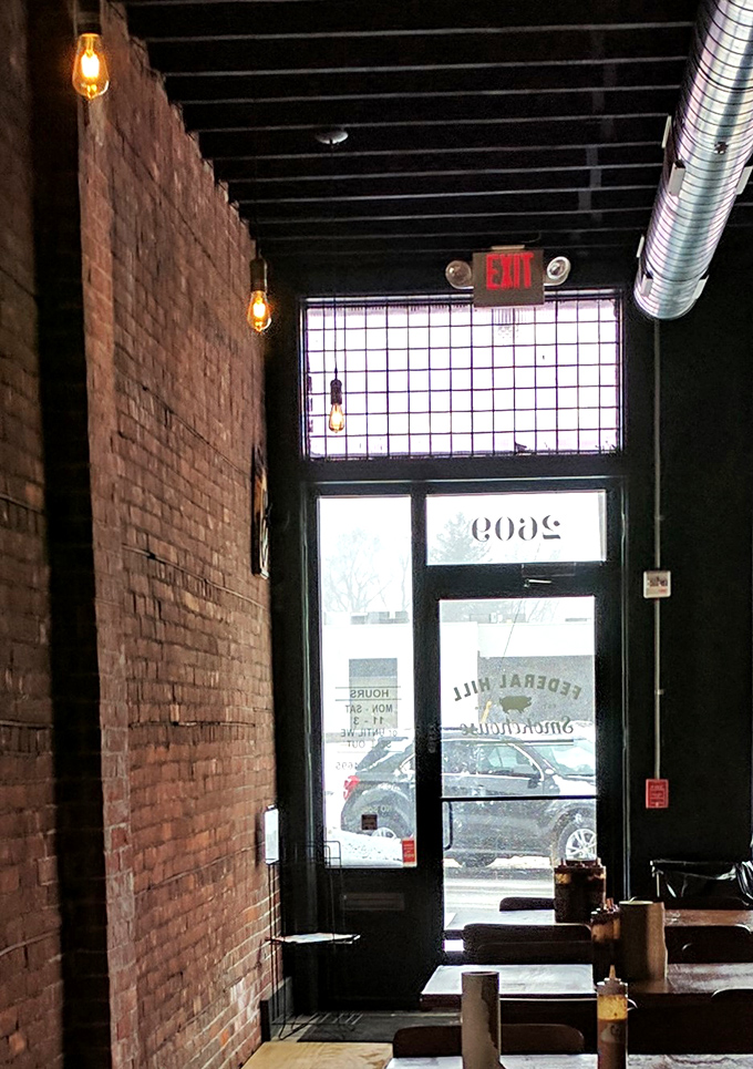 The entrance view reveals the temple-like quality of great barbecue joints – modest on the outside, transcendent on the inside.