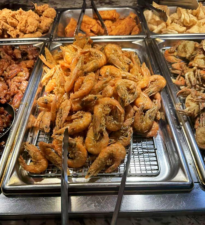 Fried shrimp so plentiful they're practically spilling over the edges. The buffet equivalent of "go ahead, take another – we've got plenty!"