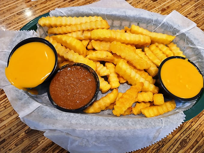 Crinkle-cut fries with dipping sauces – the supporting actors who sometimes steal the show. That cheese sauce should win an Emmy.