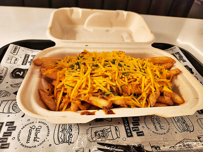 Cheese fries that don't mess around—crispy potatoes blanketed in melted cheddar that stretches with each bite like in those slow-motion food commercials.