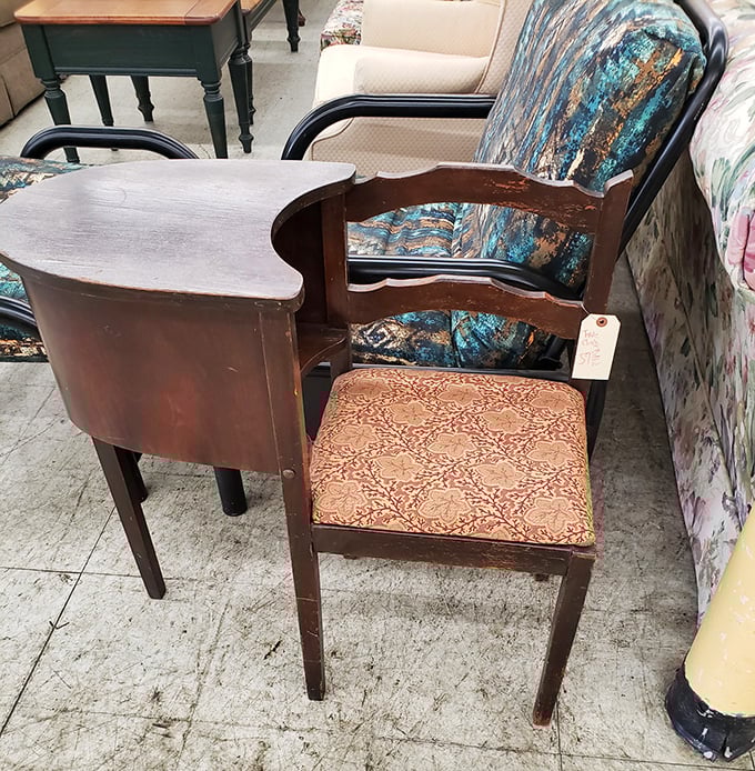 The gossip bench—that charming relic from when phone calls were events and multitasking meant talking while sitting.