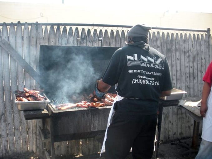 Where the magic happens—smoke billowing around meat on the grill, transforming ordinary cuts into extraordinary barbecue through time, patience, and skill.