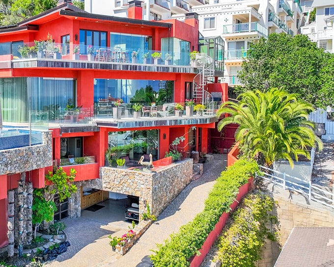 This striking red hillside villa proves that Catalina architecture isn't just about Mediterranean whites—it's about dramatic views and living on the edge, literally.