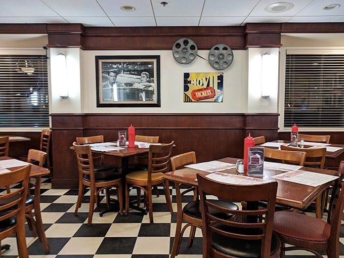 The dining area feels like the set of "Happy Days" but with better food. Those movie reels on the wall aren't just decoration—they're foreshadowing the feature presentation on your plate.
