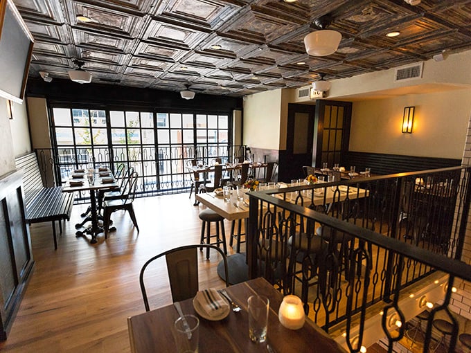 The upstairs dining area offers a slightly more intimate experience, though you'll still hear the symphony of satisfied sighs from fellow diners.