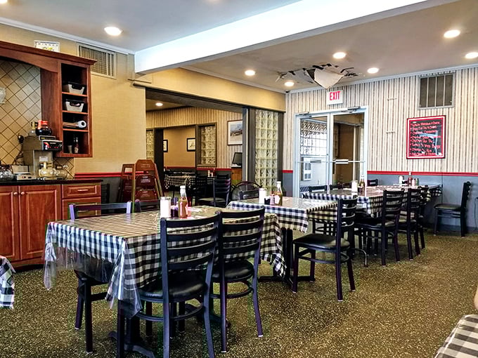 Classic diner geometry: checkered tablecloths, wooden accents, and that terrazzo floor that's witnessed countless conversations and coffee refills.