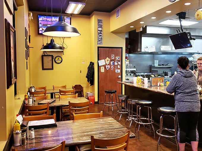 Wooden tables, yellow walls, and pendant lighting create the perfect backdrop for food that doesn't need fancy surroundings to shine.