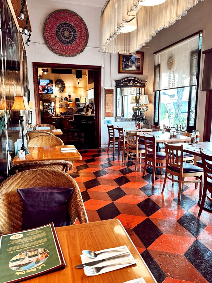 The checkered floor and woven chairs aren't just decor—they're storytellers. Each corner of this dining room has probably witnessed countless "mmms" and "oh my gods."