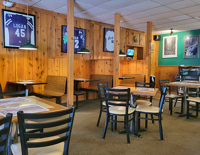 Local sports jerseys watch over diners like guardian angels of hometown pride and pizza-fueled memories.