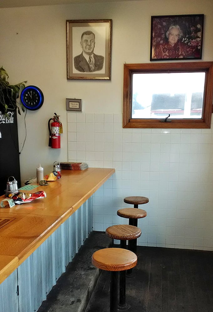 Wooden stools and vintage photographs create a time capsule of Americana where conversations flow as easily as the fountain drinks.