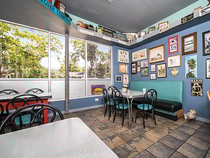 Not a designer chair in sight, just honest seating where countless happy meals have unfolded beneath a gallery of local memories.