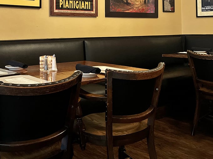 Classic Italian restaurant ambiance with leather booths and warm lighting – where memories are made between bites of pasta.