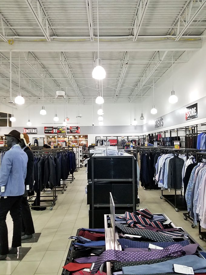 Men's fashion nirvana with high ceilings and low prices—where ties line up like colorful soldiers and suits await their next adventure.