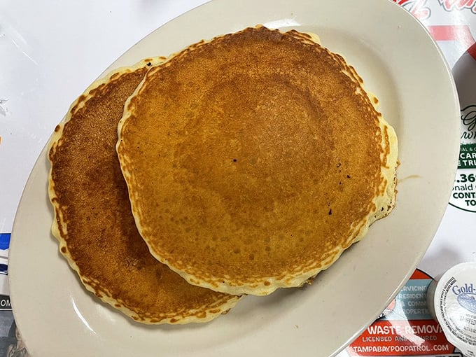 These pancakes aren't trying to be fancy—they're just trying to be perfect. Golden, fluffy, and bigger than your plate. Mission accomplished.