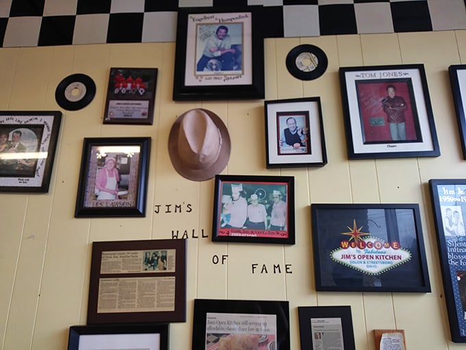 "Jim's Wall of Fame" showcases decades of local history and celebrity visits through yellowing photographs and memorabilia.
