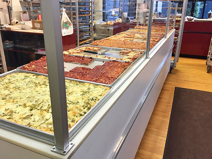 The savory side of paradise – sheet pans of pizza that prove Bakery Delite understands all dimensions of dough.