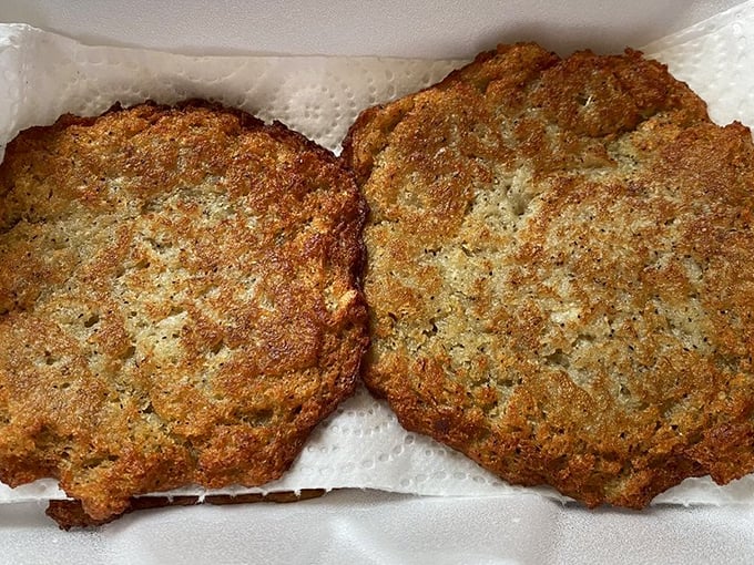 These potato pancakes aren't just crispy—they're the gold medal winners of the starch Olympics. Impossibly crisp exteriors hiding fluffy, savory centers.
