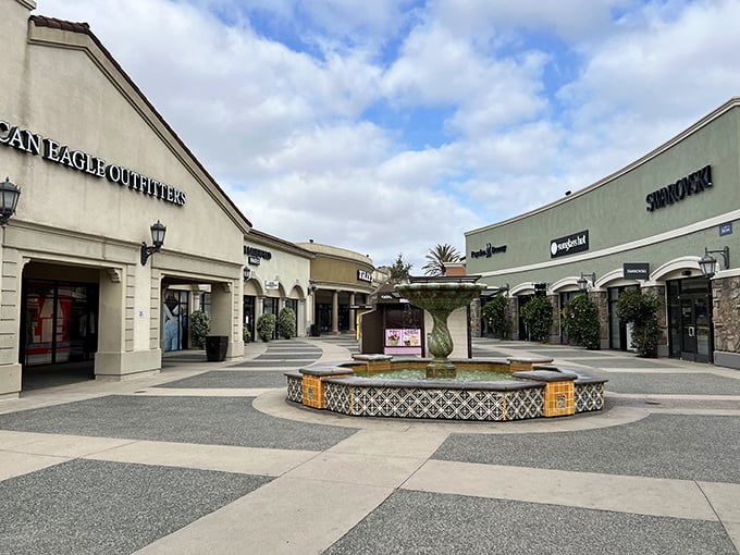 American Eagle and Swarovski face off across a courtyard fountain – the retail version of "choose your fighter."