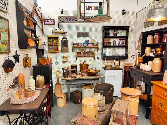 A perfectly curated kitchen booth transports you to grandma's farmhouse, complete with coffee grinder and butter churn.
