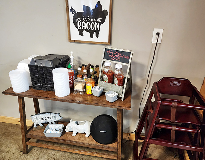 "You had me at bacon"—the wall art speaks truth while the sauce station stands ready to customize your BBQ experience with various levels of tang and heat.
