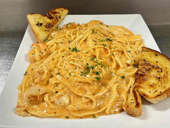 Creamy pasta perfection with chunks of seafood and toasted garlic bread—because Pennsylvania diners know Italian comfort food isn't just for Italian restaurants.