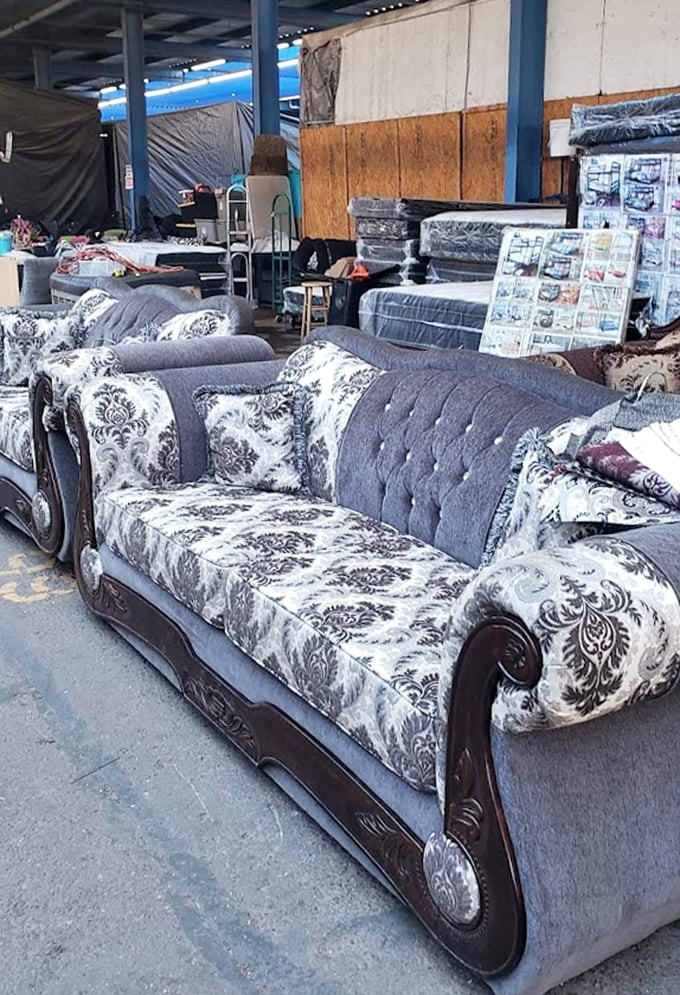 Living room luxury at flea market prices! These ornate sofas bring formal elegance to the most casual bargain-hunting expedition.