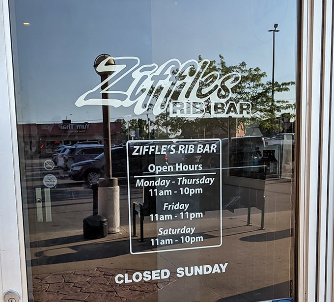 Hours of operation posted clearly—because knowing when you can get your next rib fix is essential information for mental health planning.