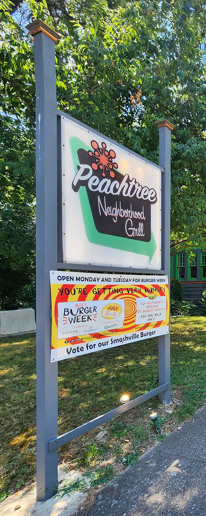 The sign says it all – this isn't just a restaurant, it's a neighborhood institution that participates in community events like Burger Week.