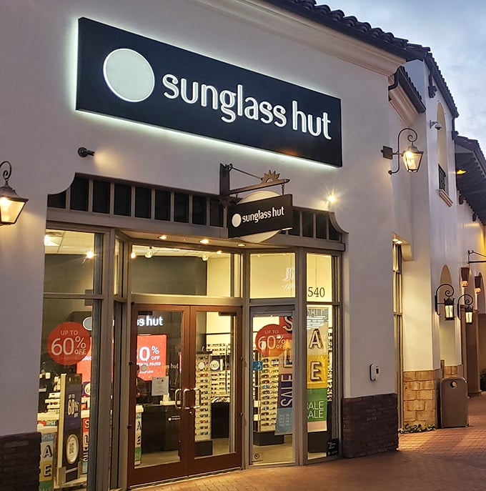 Sunglass Hut's 60% off signs create that special moment when "I shouldn't" transforms magically into "I deserve this."