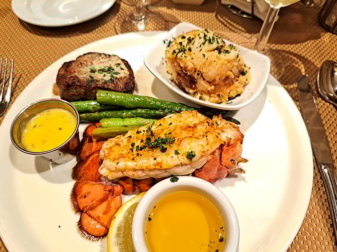 Surf meets turf in perfect harmony: succulent lobster tail alongside a perfectly seared filet, proving that some classic combinations never go out of style.