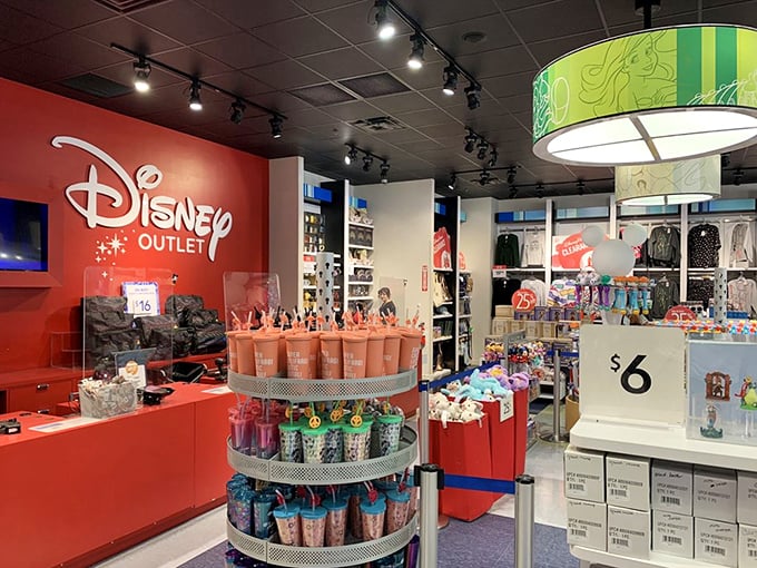 The Disney store's tumbler display—because even your hydration deserves magical flair and conversation-starting potential.