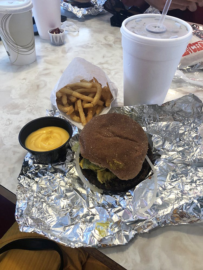 A burger that proves simplicity is the ultimate sophistication—perfectly seasoned, grilled to perfection, and served without unnecessary fanfare.