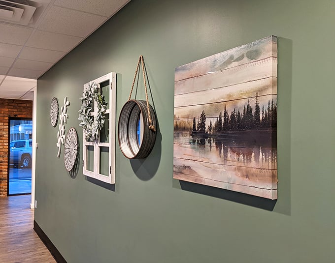 The wall décor strikes that perfect balance between "thoughtfully curated" and "not trying too hard," like someone with excellent taste who pretends they just threw it together.