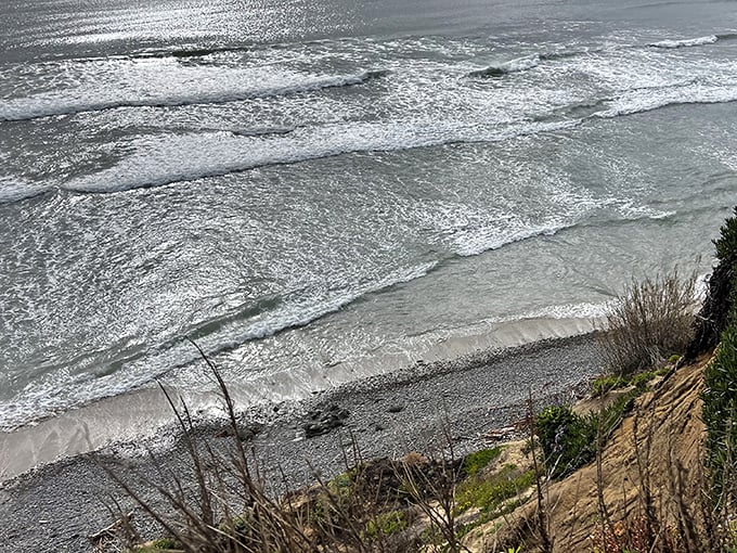 Silver waves ripple toward shore like mercury in motion. The Pacific puts on a different light show depending on the clouds above.