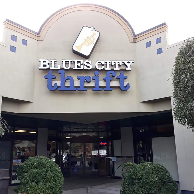 Blues City Thrift's tag logo floats above Memphis like a promise of vintage gold.