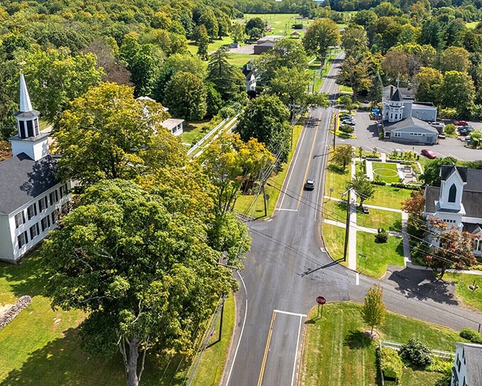 Church spires and colonial buildings nestle among mature trees where quiet residential streets offer affordable small-town living.