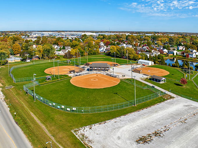 Baseball diamonds gleam like emeralds in this suburban paradise where recreation meets reasonable living costs perfectly.