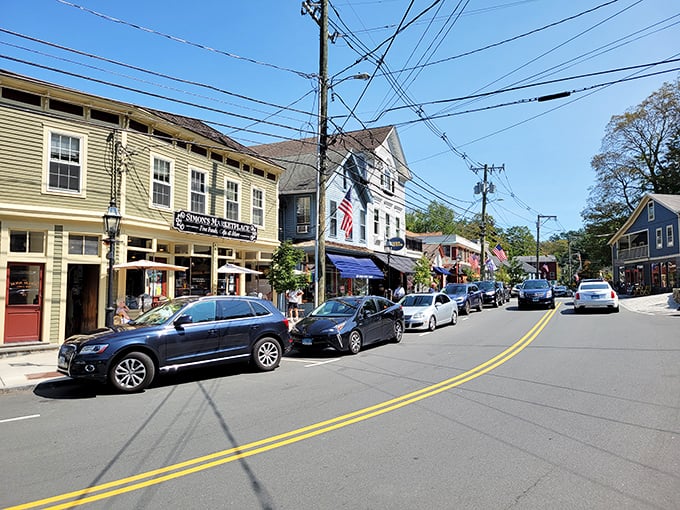 Historic main street buildings stand shoulder to shoulder like old friends, their varied colors and styles creating harmony through cheerful diversity.
