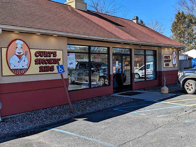 Curt's unassuming storefront with its cartoon chef logo proves great barbecue doesn't need fancy packaging—just smoke, time, and skill.