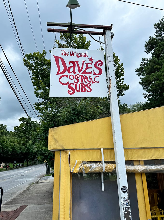 Dave's Cosmic Subs' vintage sign promises a groovy sandwich experience. This little yellow building houses flavor combinations that are truly out of this world.