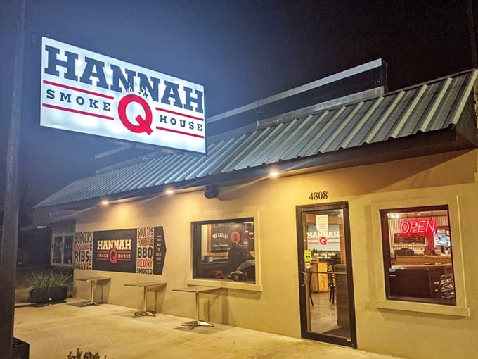 Hannah Q's illuminated sign glows like a barbecue beacon in the night – a North Star for those seeking smoky perfection.