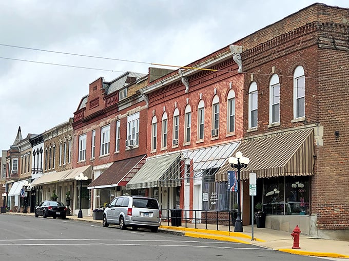 Brick-and-mortar money-savers! Le Roy's historic storefronts stand shoulder-to-shoulder like retirees comparing notes on how far their dollars stretch here.