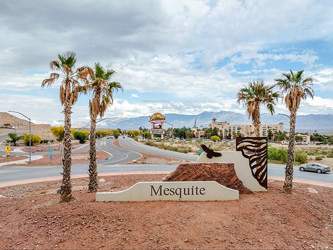 Mesquite welcomes visitors with palm trees and a desert-inspired entrance sign that promises affordable adventures ahead.