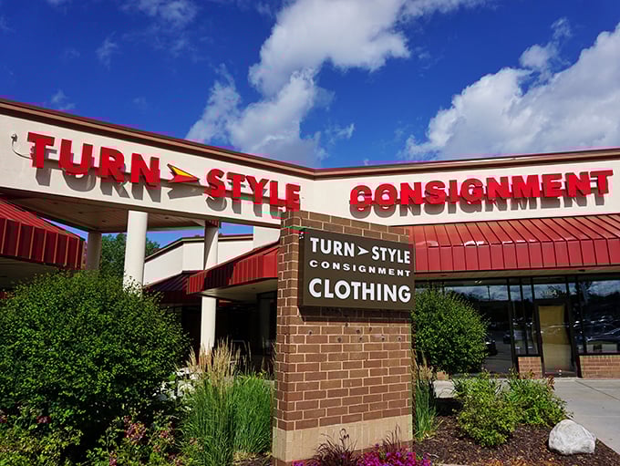 Bold red letters announce consignment shopping that's more boutique than basement sale—sophistication meets sensible spending here beautifully.