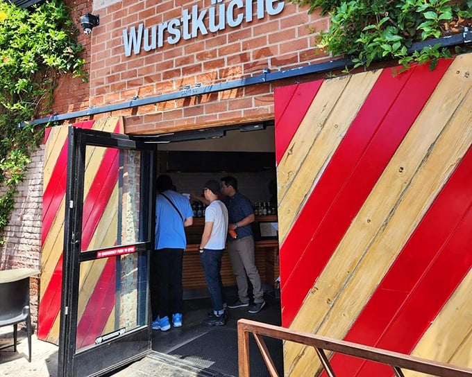 Wurstküche's striking red and wood design hints at the exotic sausage adventures waiting inside this culinary playground.
